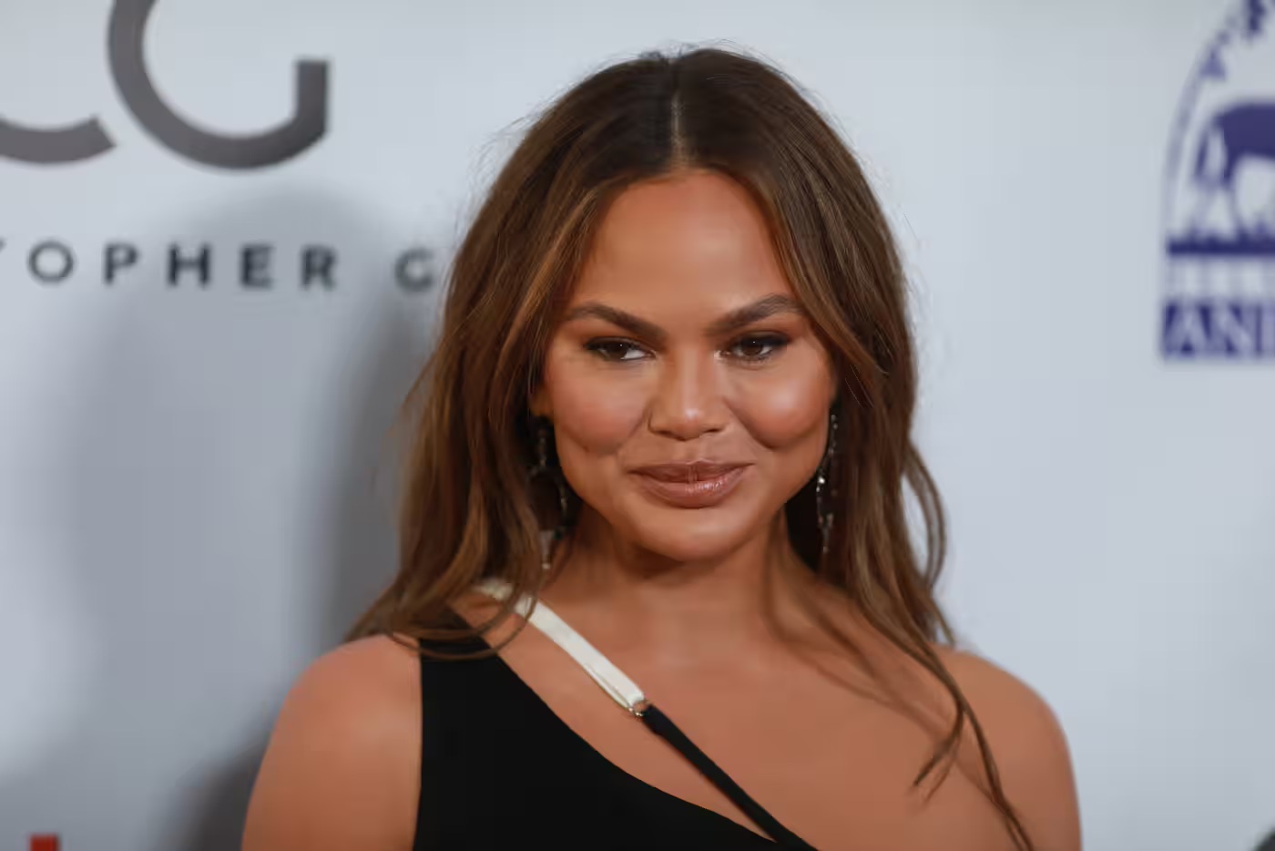 Chrissy Teigen Suffers Wardrobe Malfunction, Dress Splits Wide Open At Gala