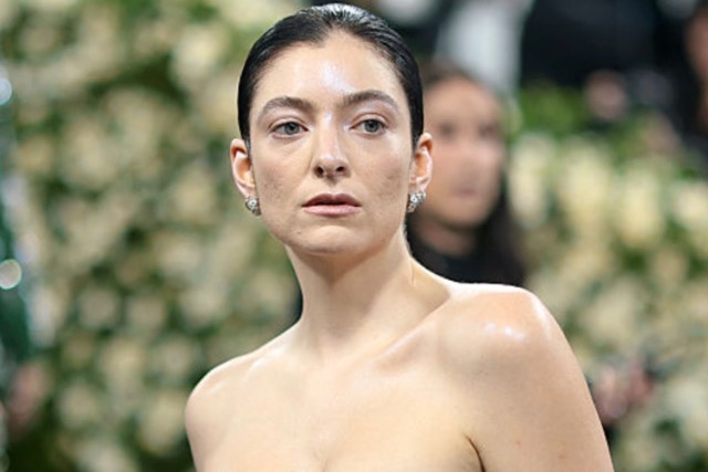 Lorde Sheds Her Jacket on Met Gala Red Carpet to Unveil Revealing Look